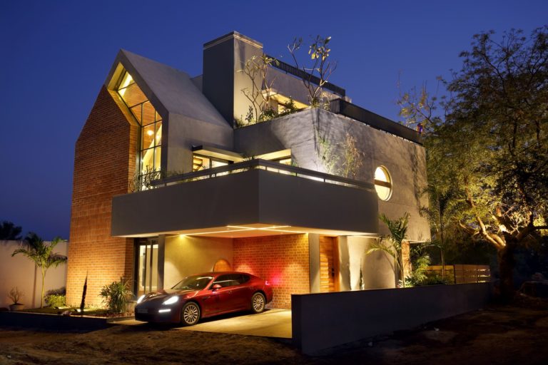 An Exposed Brick Front Elevation Gives the Villa an Evergreen Look ...