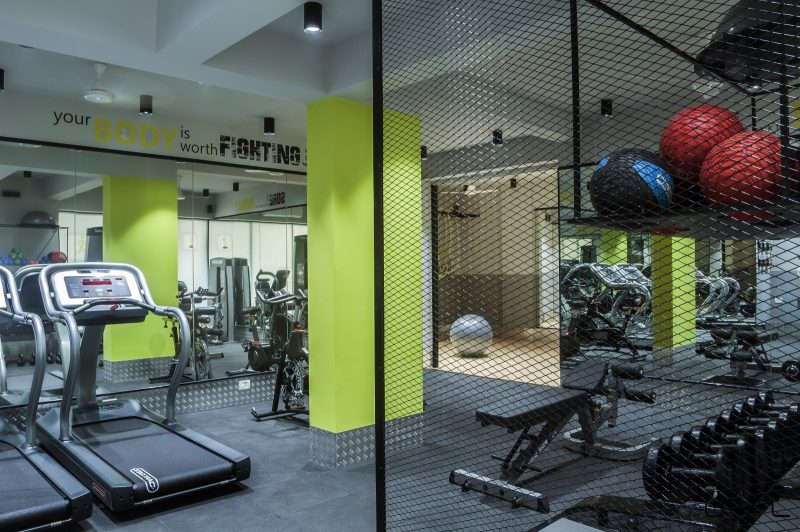 Gym Design With Bright Lime Green Highlighted In Neutral Surrounds ...