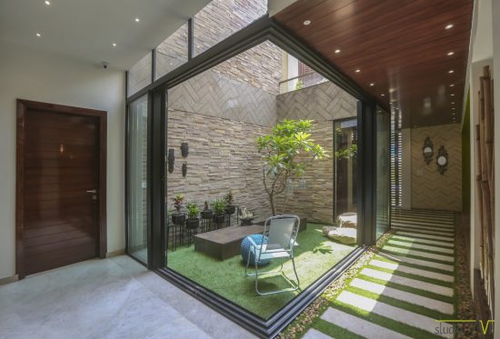 Facade With Staggered Rectangular Volumes That Greets With Warmth And ...