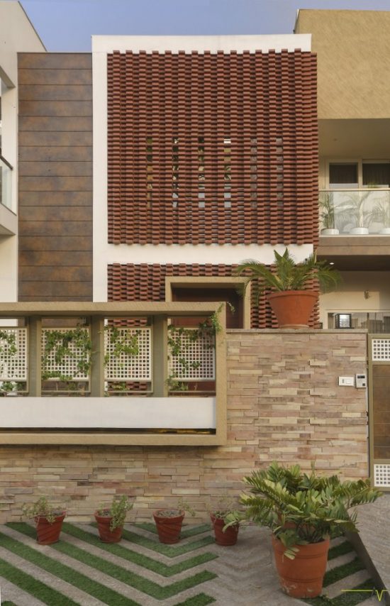 Facade With Staggered Rectangular Volumes That Greets With Warmth And ...