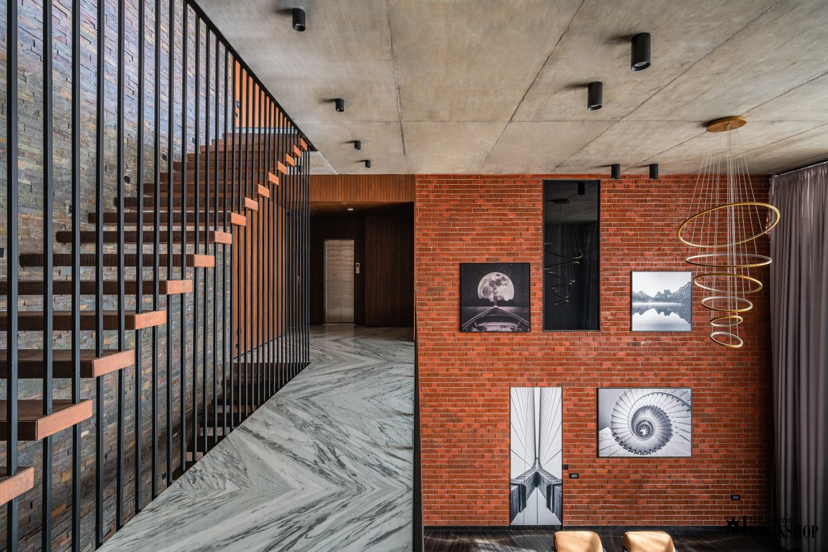 Exposed Brick and RCC creating Compositional Structure of the Residence ...