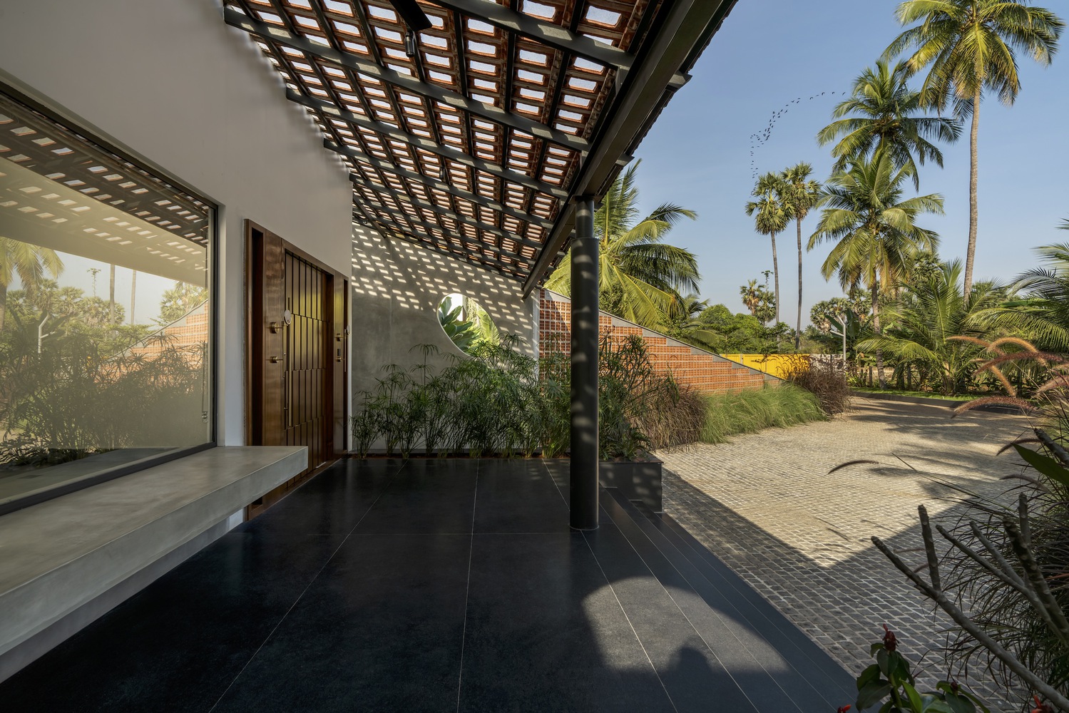 The Inclined Porotherm Block Jali Wall is an Entrance Portal ...