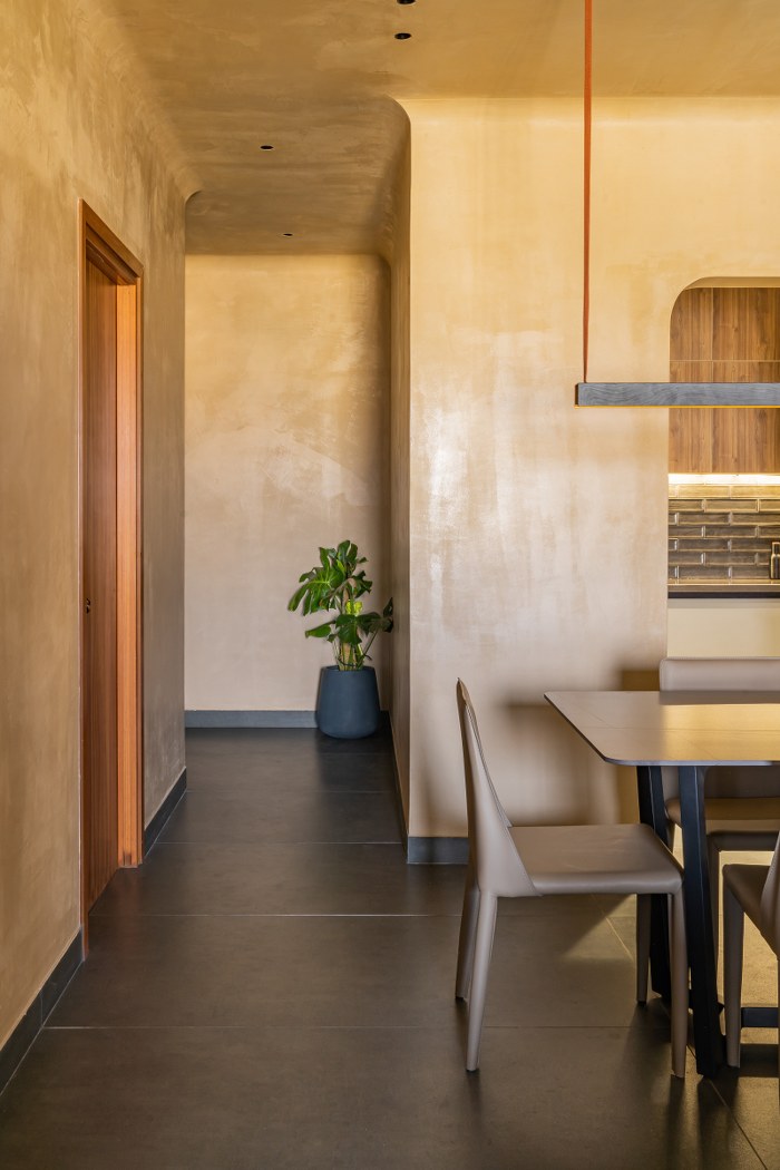 The Interior Of This Modern Indian House Design Has A Warm Earthy ...