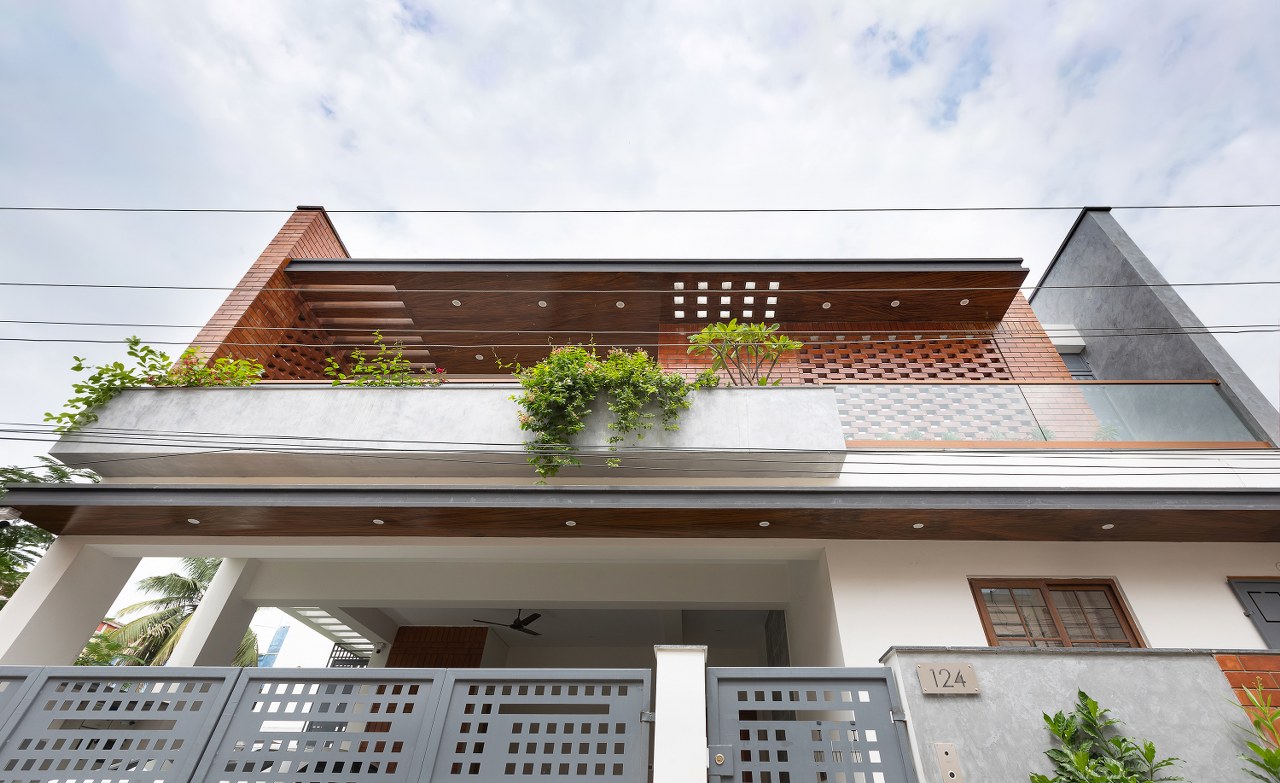 This Facade Design House Creates a Pierced Plane of Open Space Within ...