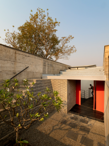 This Slope House Is A Functional Retreat Amidst Nature | Red Brick Studio