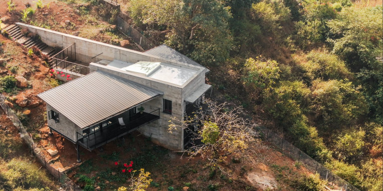 This Slope House Is A Functional Retreat Amidst Nature | Red Brick Studio