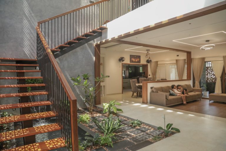 Silhouette House's Sloping Roof Design Blends Modern Living & Nature ...