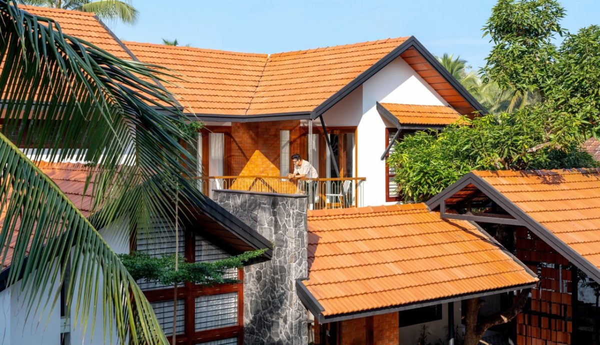 This Tropical Home Design Features A Striking Sloped Terracotta Roof In Kerala | Vriksha Architects