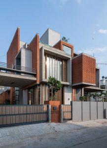 The Residence Features An Exposed Brick Design That Enhances Its Street ...