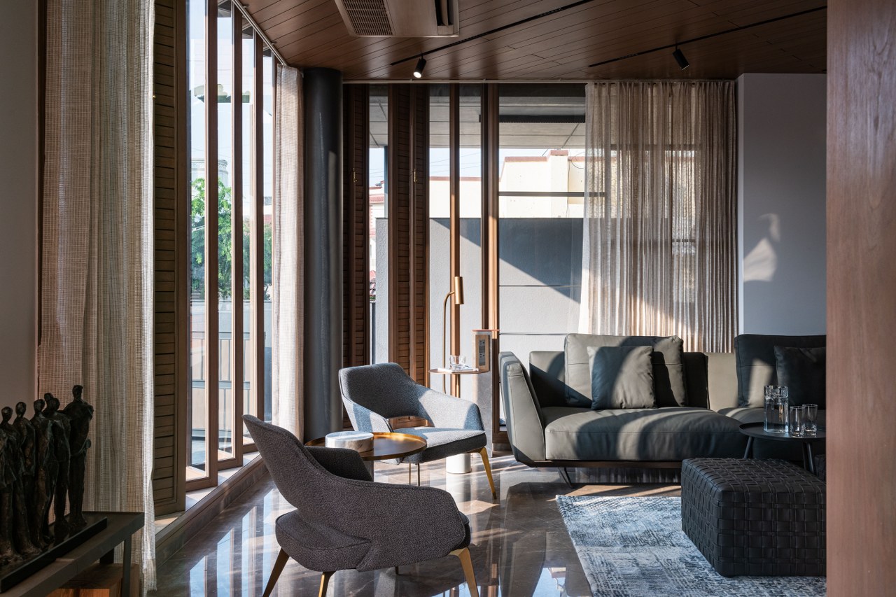 The Residence Features An Exposed Brick Design That Enhances Its Street ...