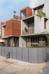 The Residence Features An Exposed Brick Design That Enhances Its Street ...