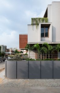 The Residence Features An Exposed Brick Design That Enhances Its Street ...