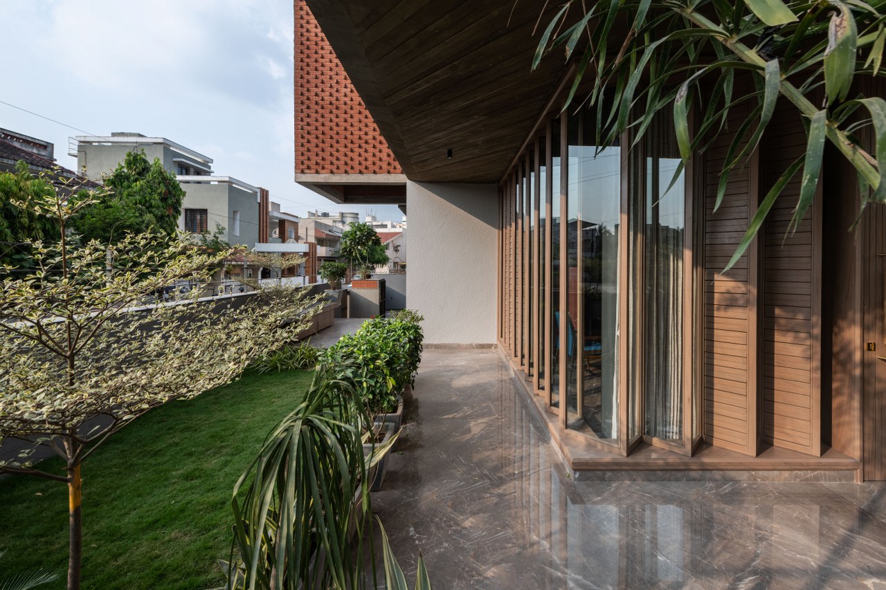 The Residence Features An Exposed Brick Design That Enhances Its Street ...